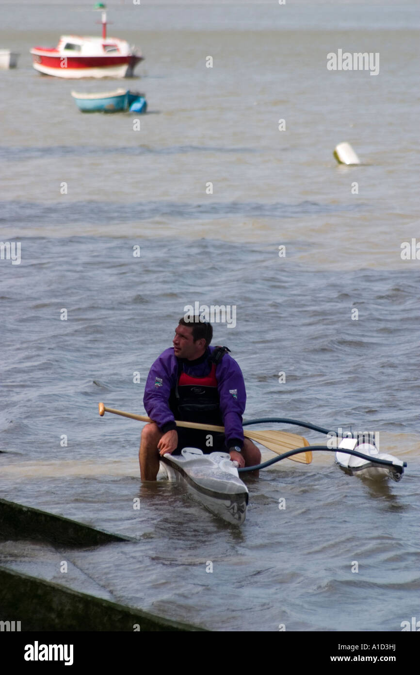 Man paddling on outrigger canoe hi-res stock photography and images - Alamy