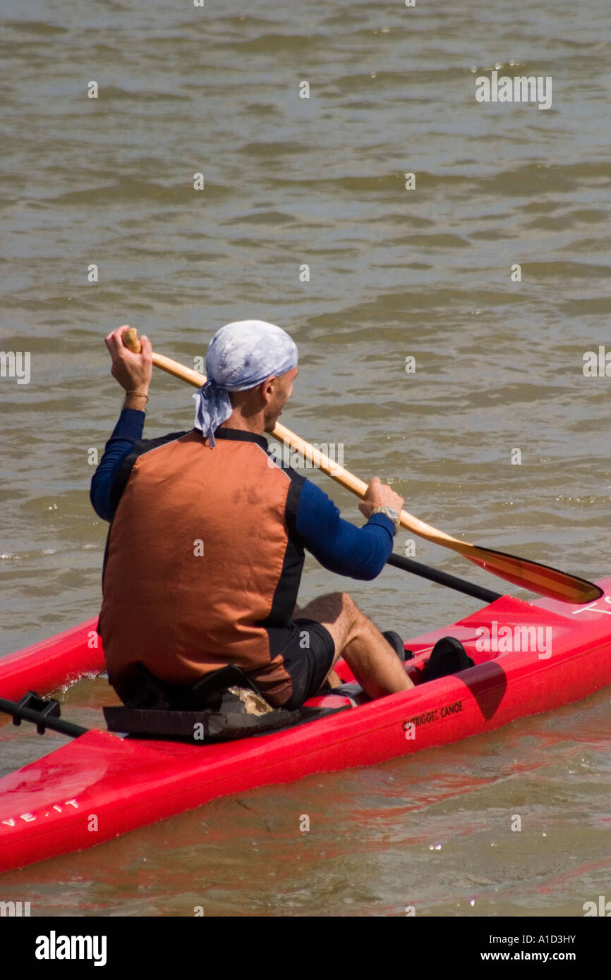Man paddling on outrigger canoe hi-res stock photography and images - Alamy