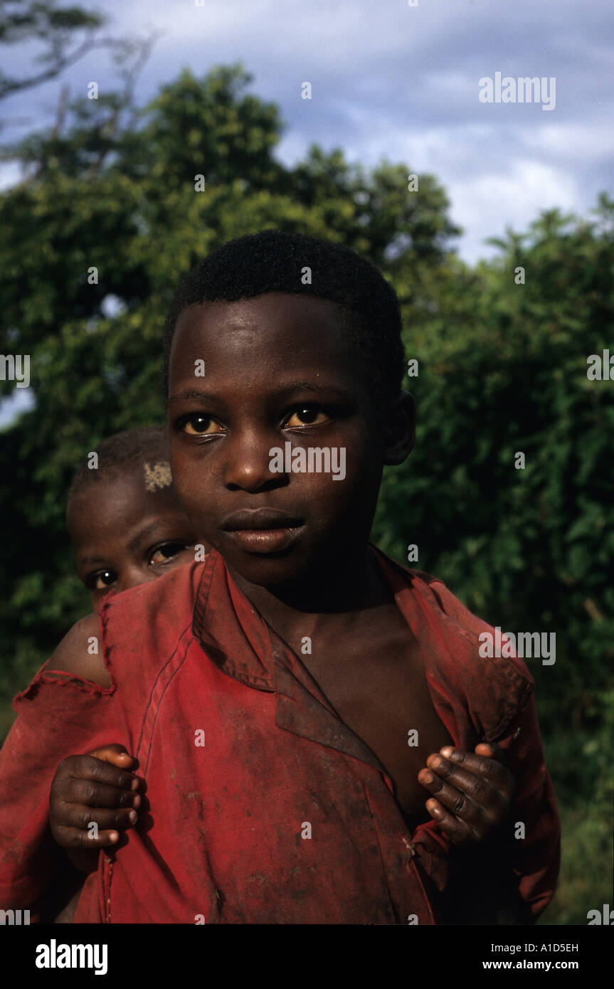 Boy looking after his baby brother Stock Photo - Alamy