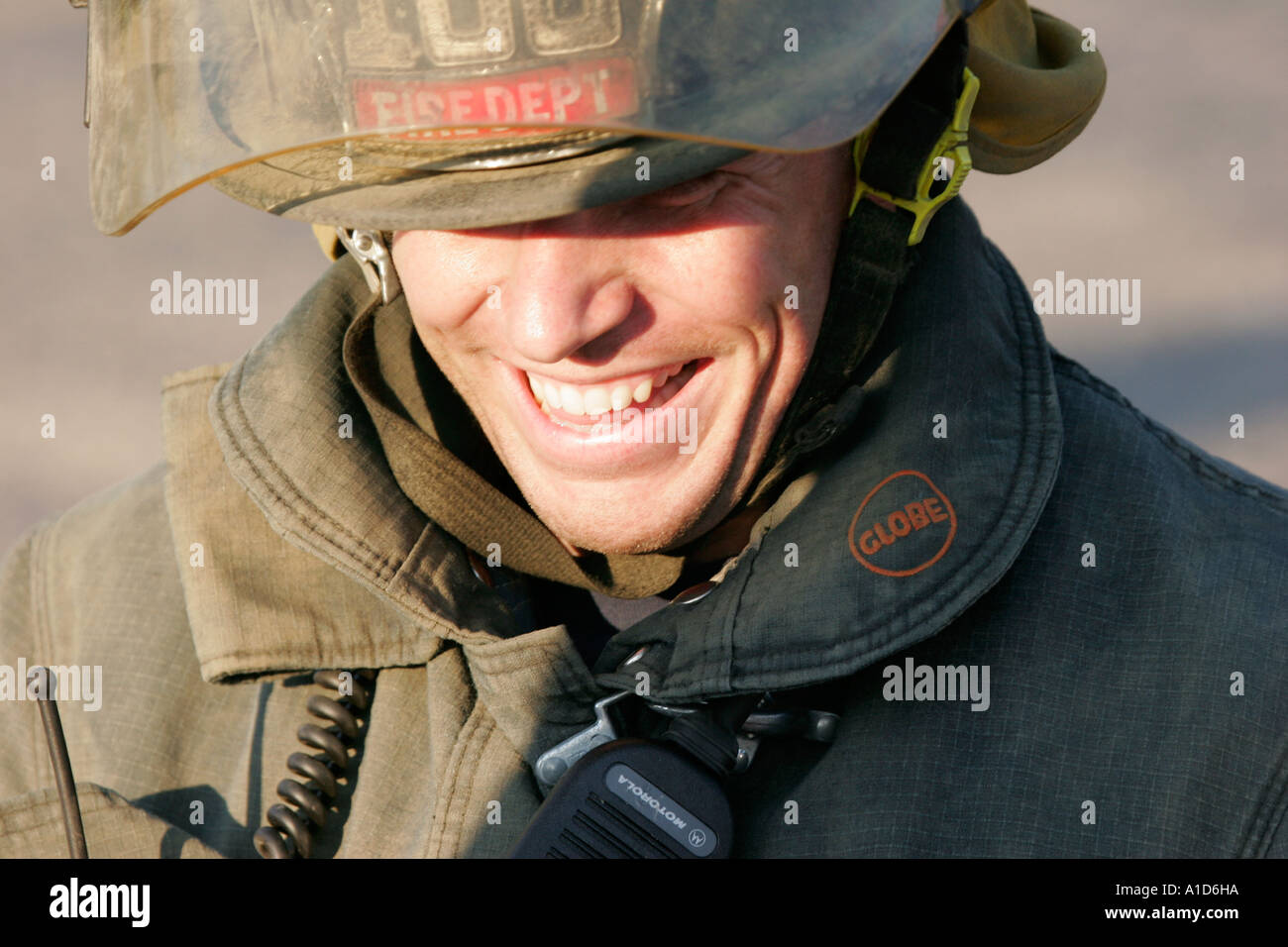 A fire fighter smiling Stock Photo - Alamy