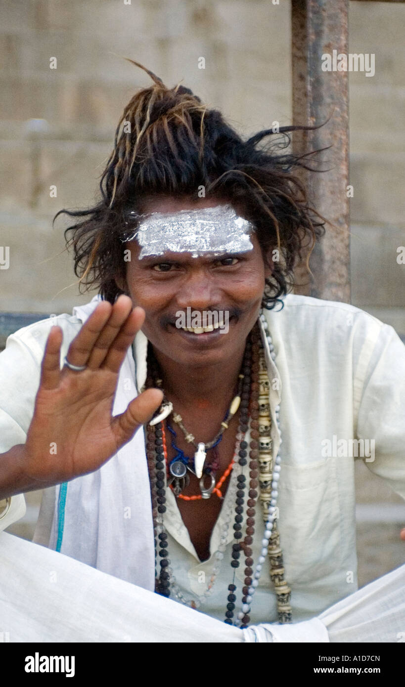 People on the ghats by the Ganges river in Varanasi Uttar Pradesh India ...