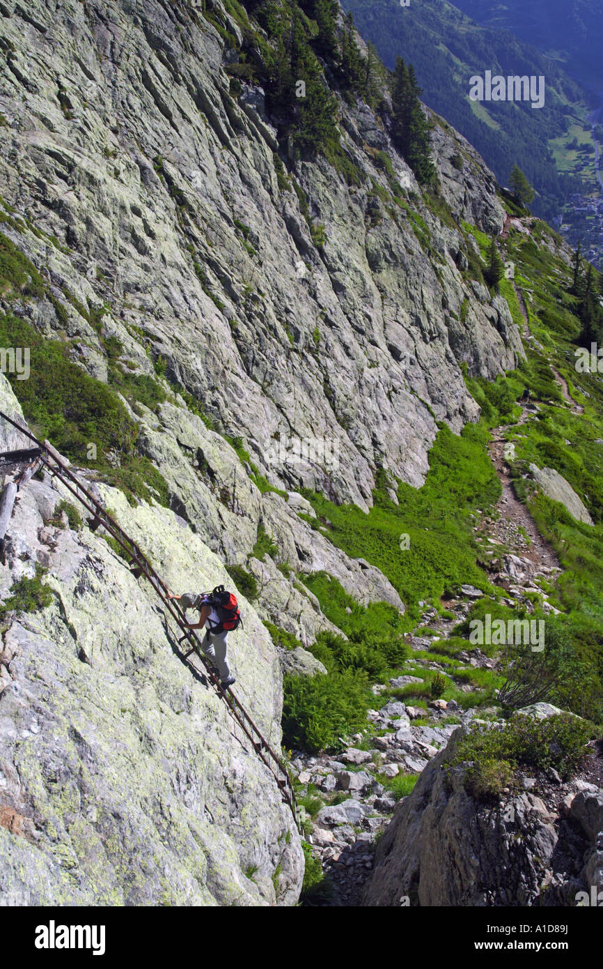 Female hiker descending a ladder in the French Alps Stock Photo - Alamy