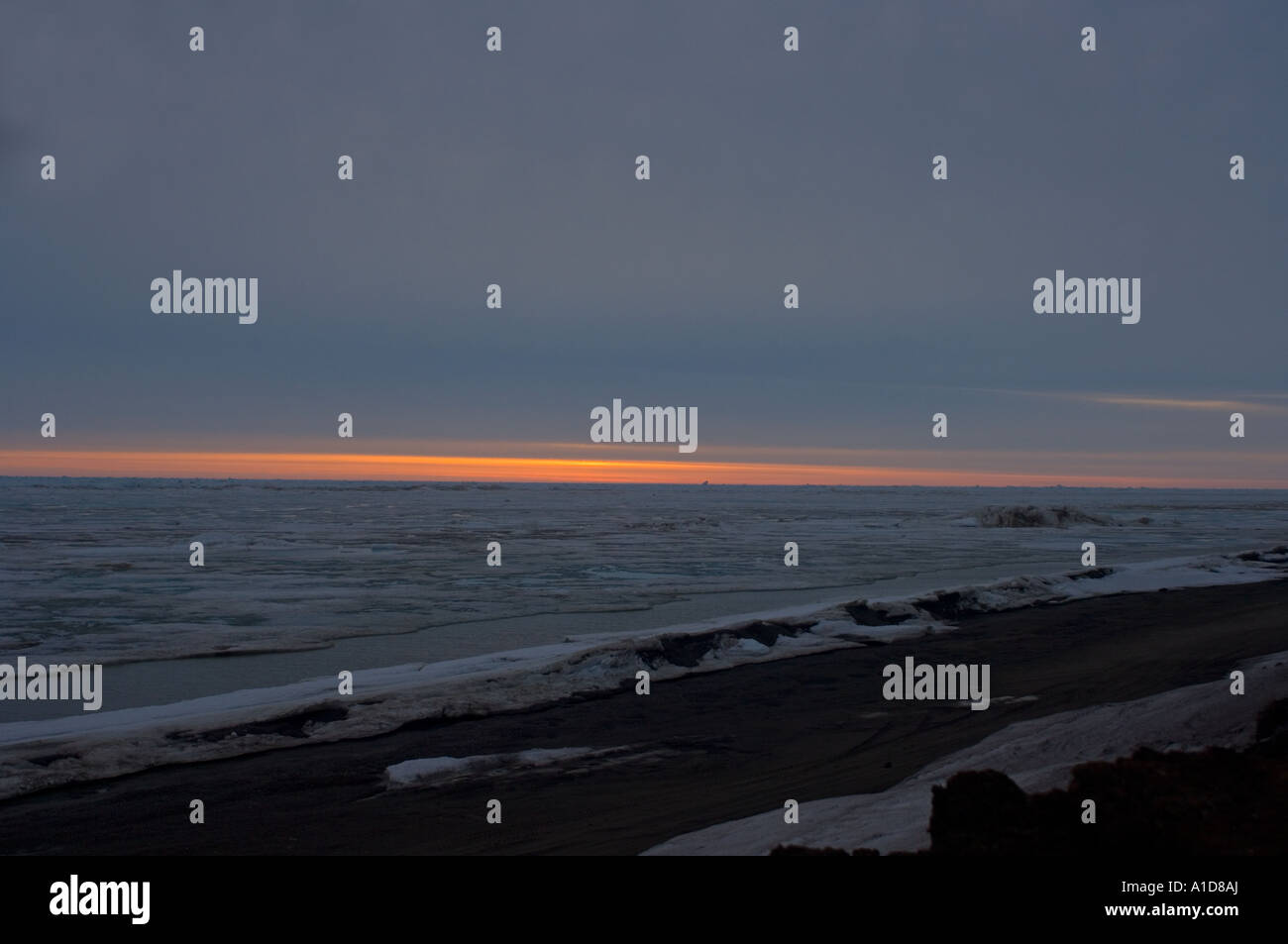 sunset along Arctic coast during spring break up south of Point Barrow ...
