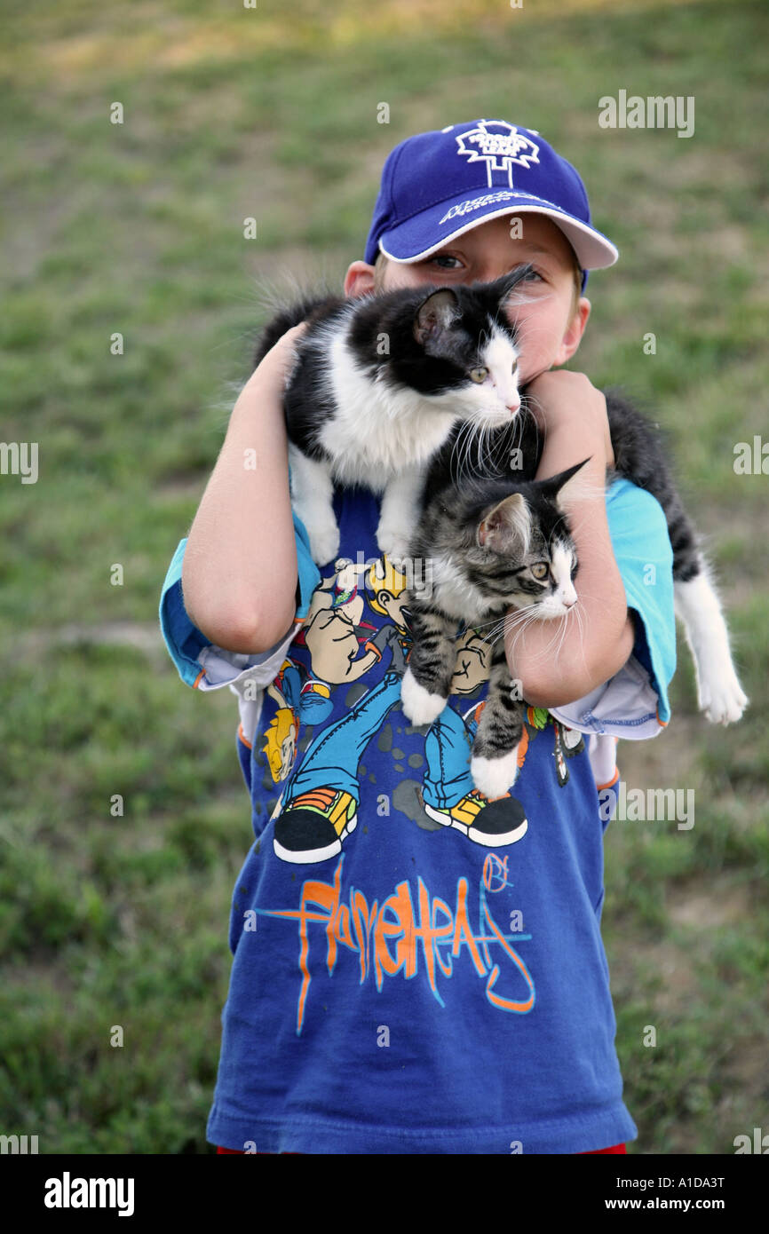 Young boy and his cats Stock Photo - Alamy
