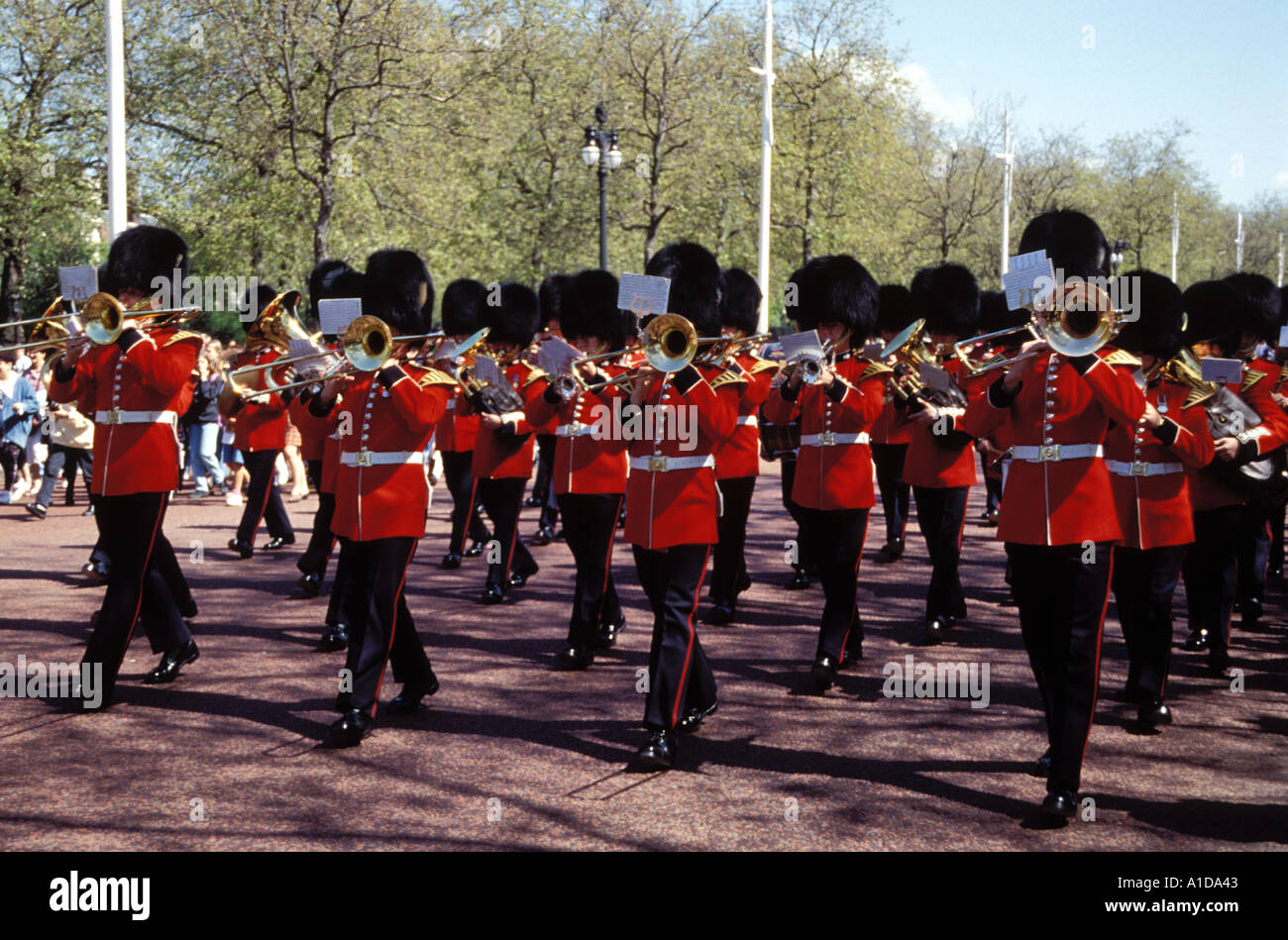 Guards band marching in dappled sunshine in The Mall to the changing of ...