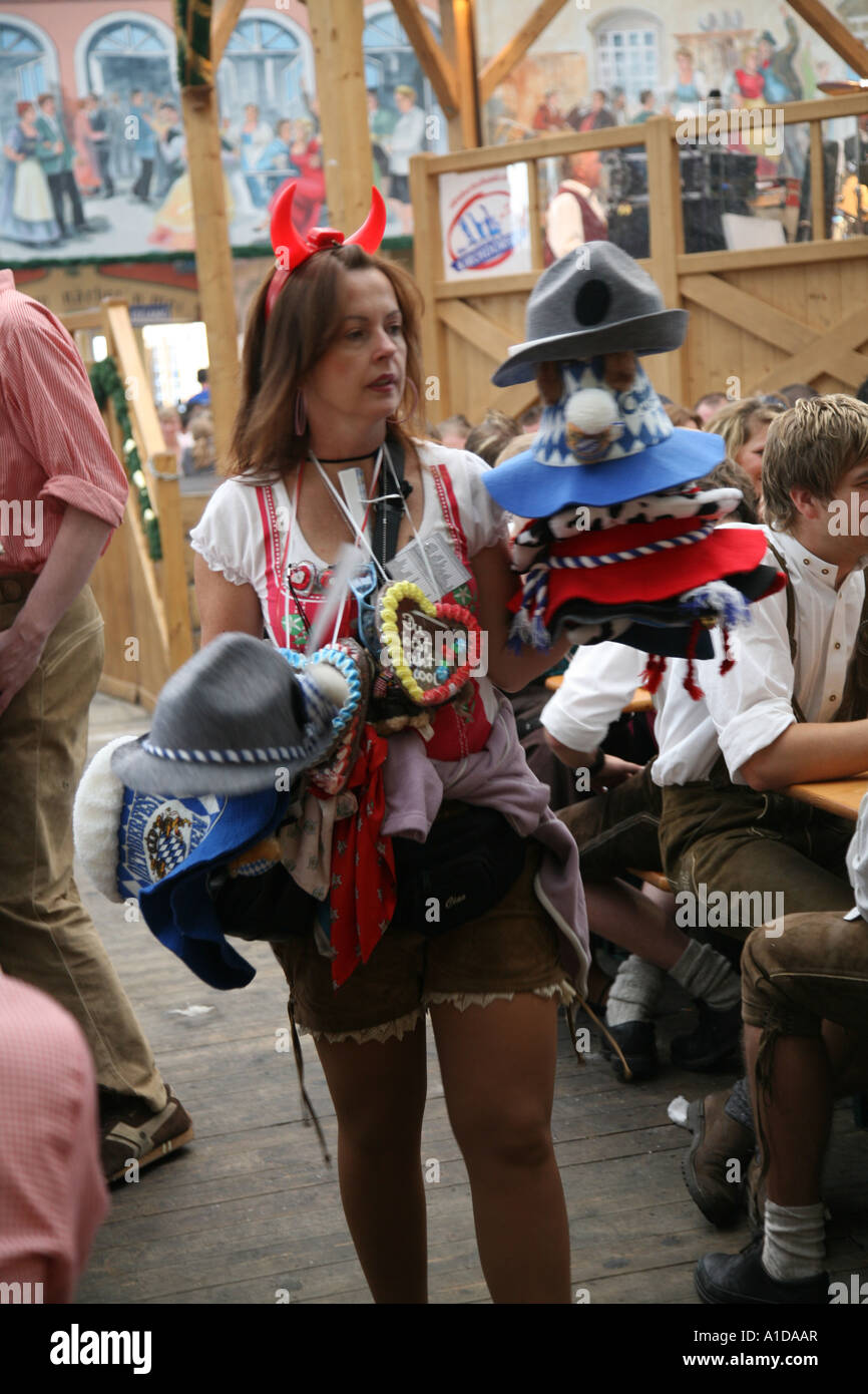 Young Lady in Leather hosen selling Souvenirs at Oktoberfest in Munich ...