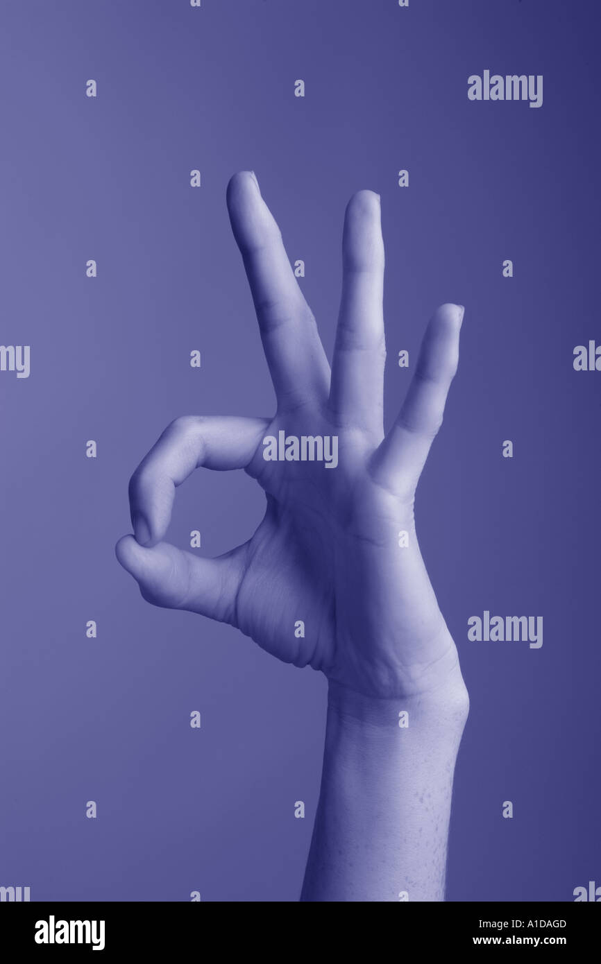Hand making the ok okay sign with fingers Stock Photo - Alamy