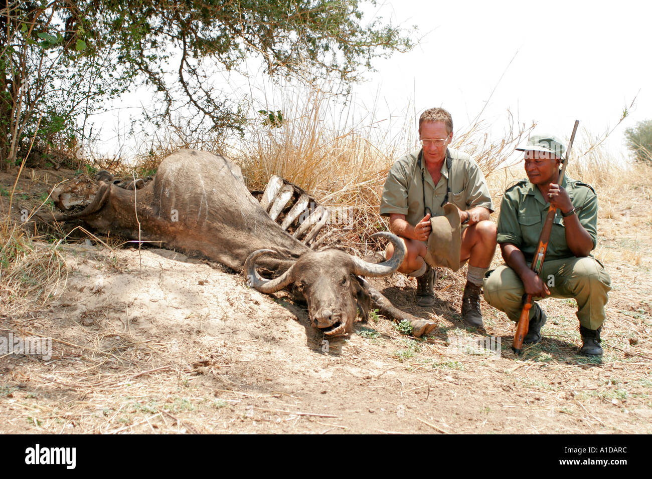 Reknowned guide Robin Pope and National Parks scout with a dead water ...
