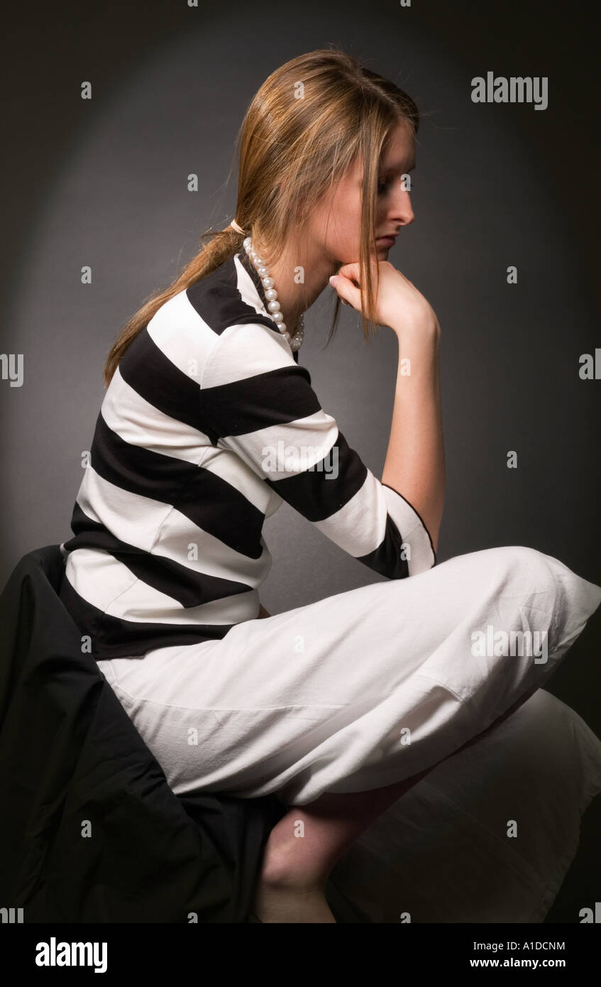 Pretty Caucasian Teen Girl (14-16) Squatting Stock Photo - Alamy