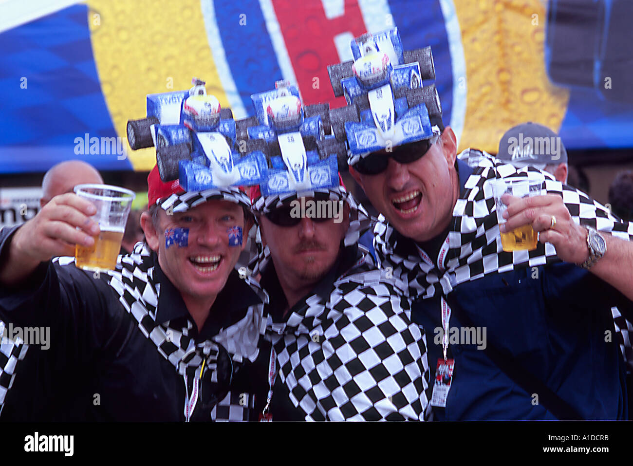 Three typically Australian spectators at the Melbourne Grand Prix Stock ...