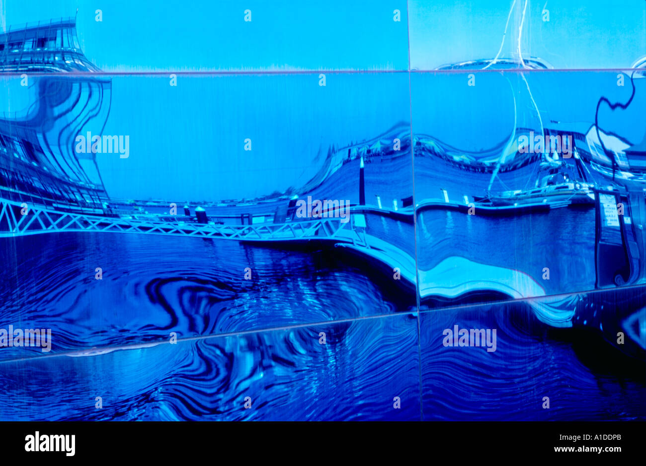 Abstract of a yacht marina reflected and distored in glass windows ...