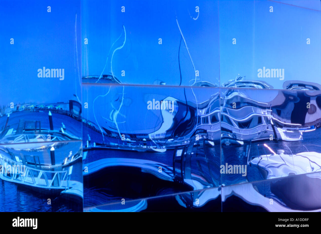 Abstract of a yacht marina reflected and distored in glass windows ...
