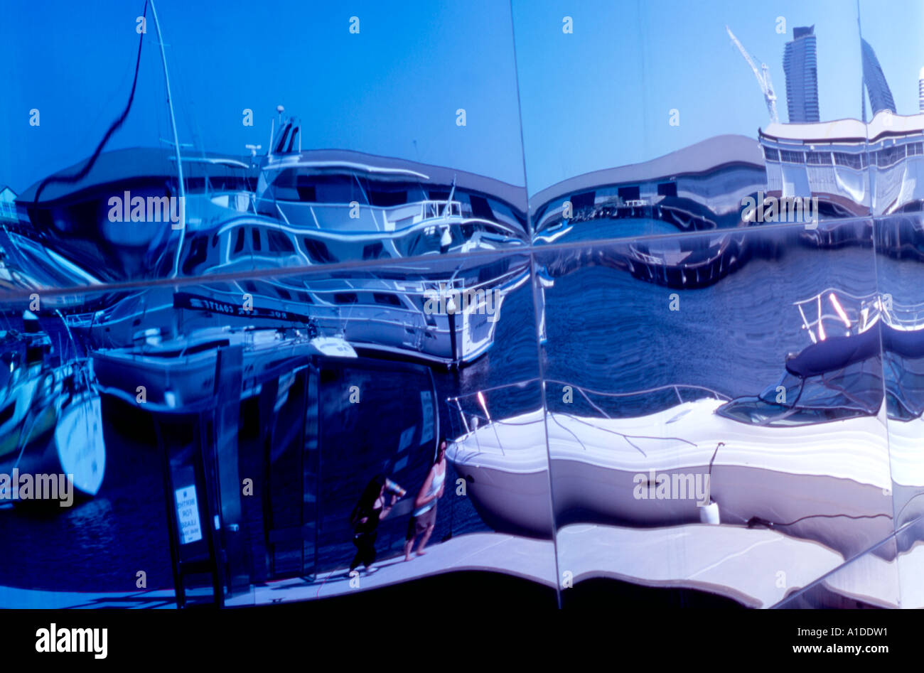 Abstract of a yacht marina reflected and distored in glass windows ...