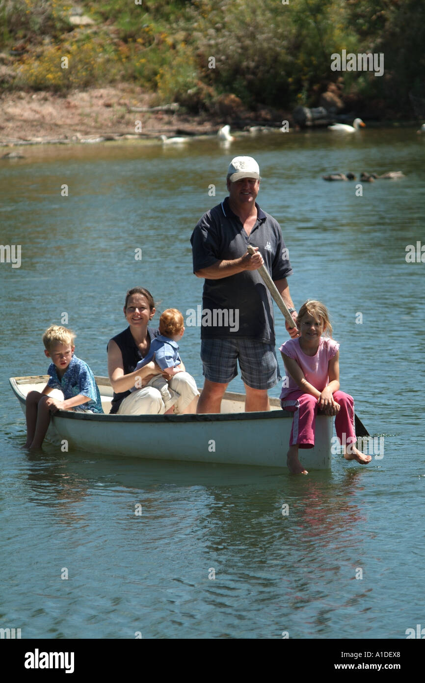 Boating family parents with children in rowing boat Summer outing on ...