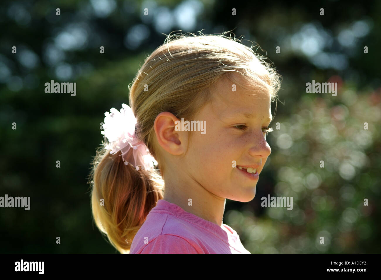Profile portrait of fair haired girl with ponytail style Stock Photo ...