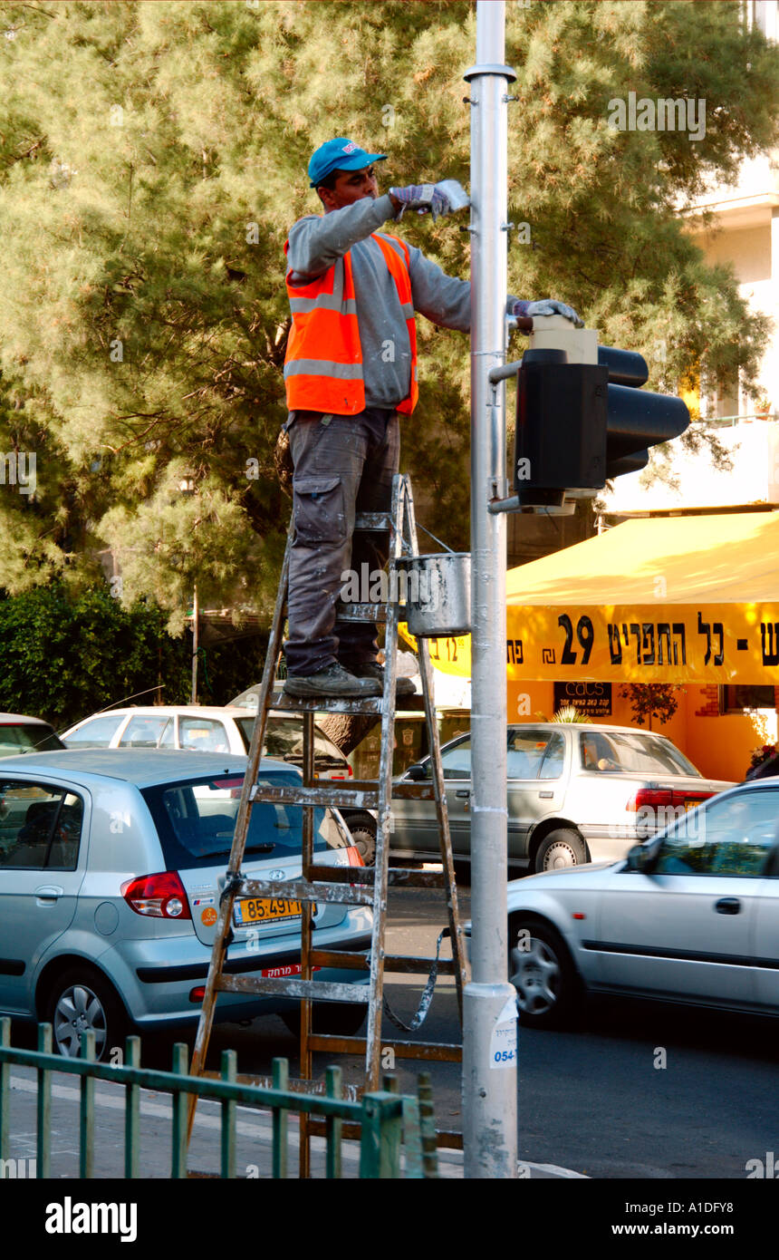 Workers Painting the traffic lights and poles Tel Aviv Israel November ...