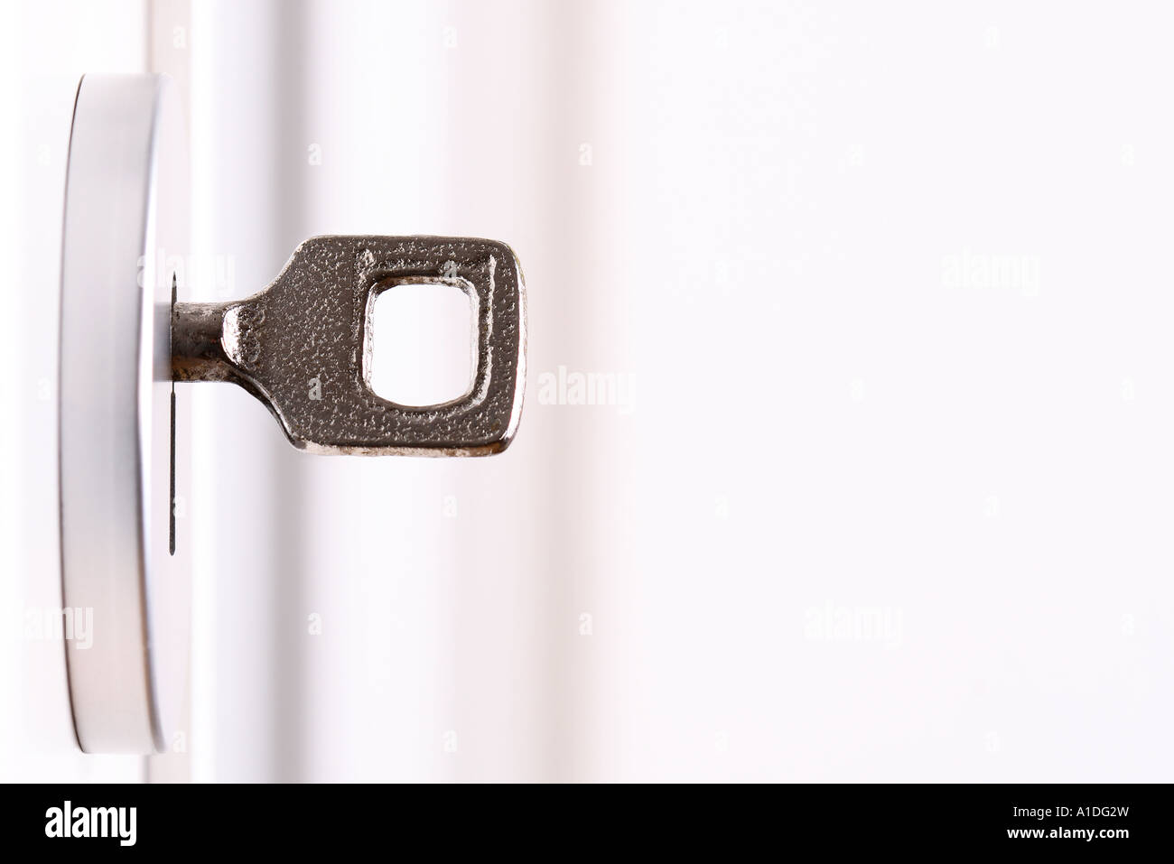 Key in the keyhole of a door Stock Photo - Alamy