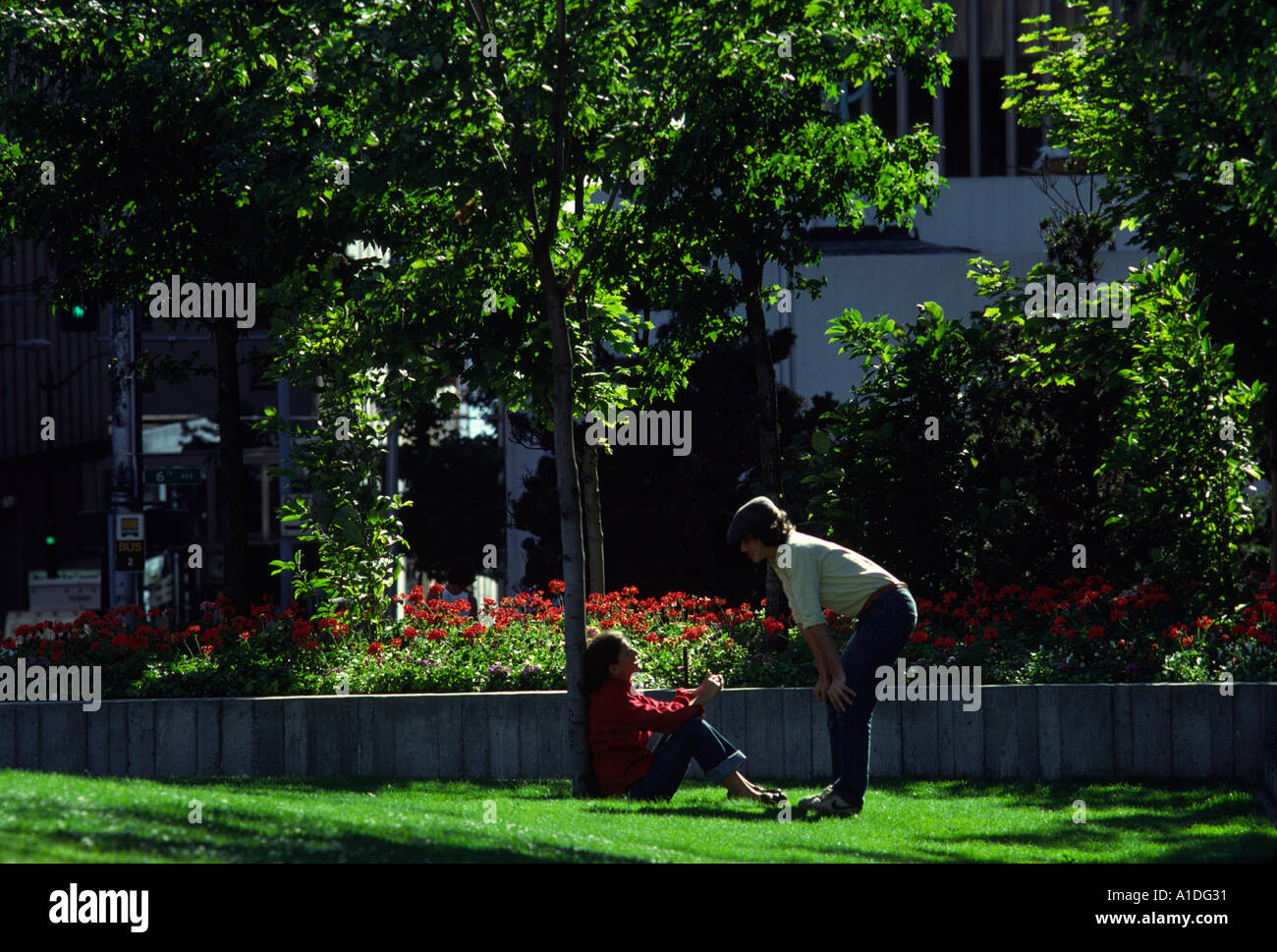 Two college students have a conversation between classes Stock Photo ...