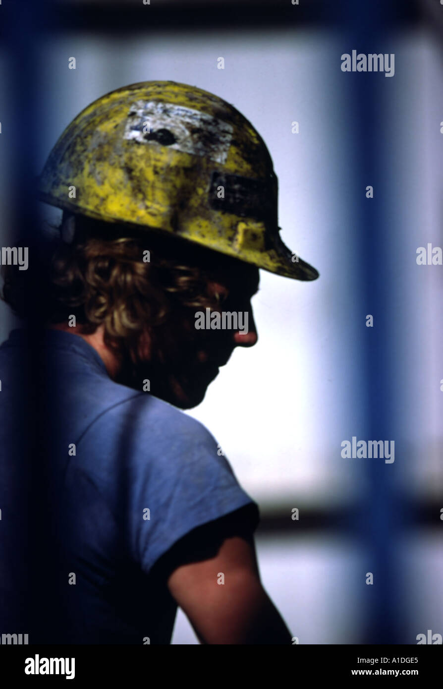 A man working on the floor of an oil rig Stock Photo - Alamy