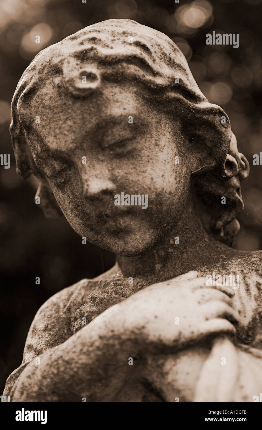 Closeup portrait of a statue of a child in a cemetery Stock Photo - Alamy