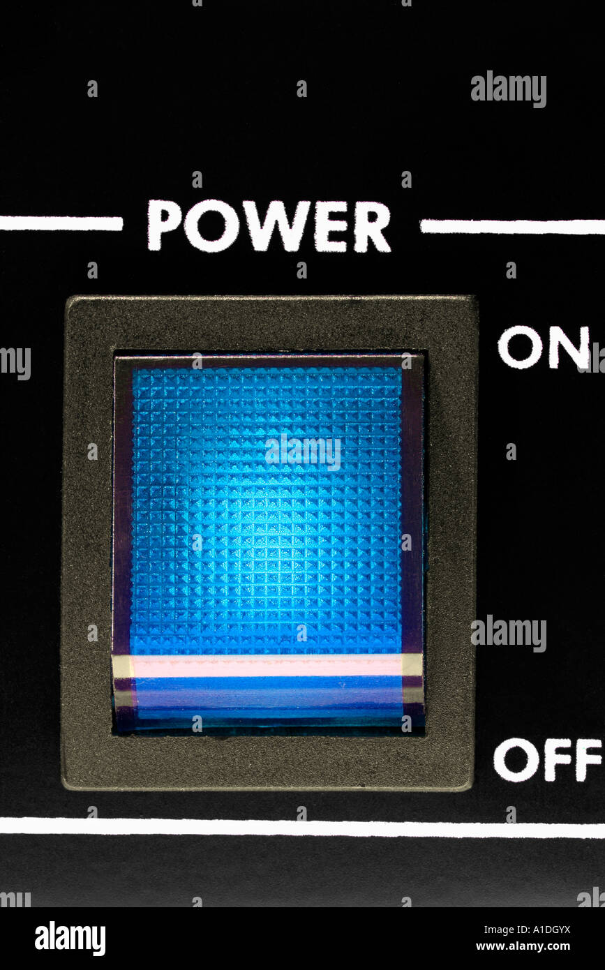 Blue power switch at a mains supply turned on Stock Photo - Alamy