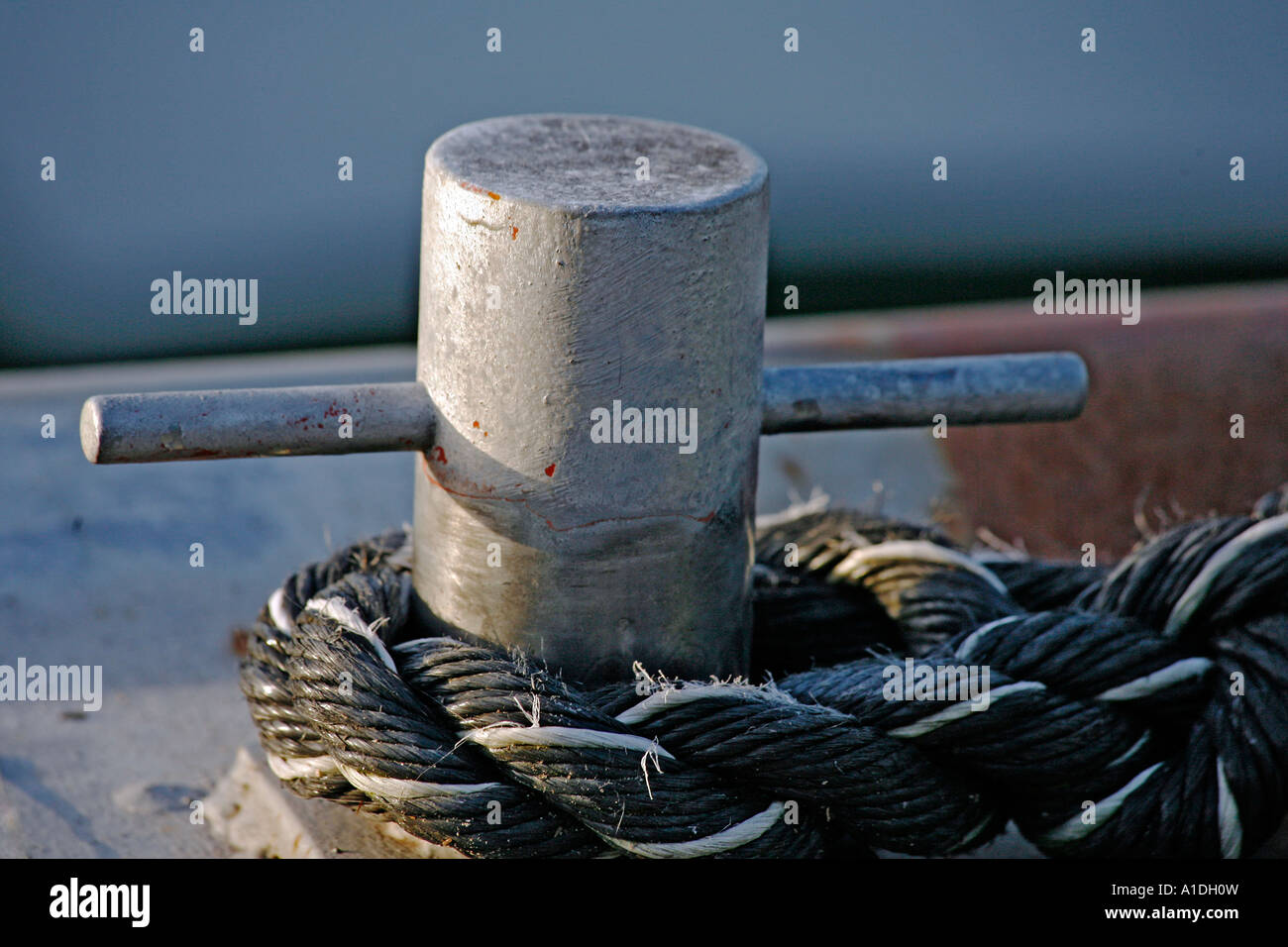 Rope attached at a steel bollard Stock Photo - Alamy