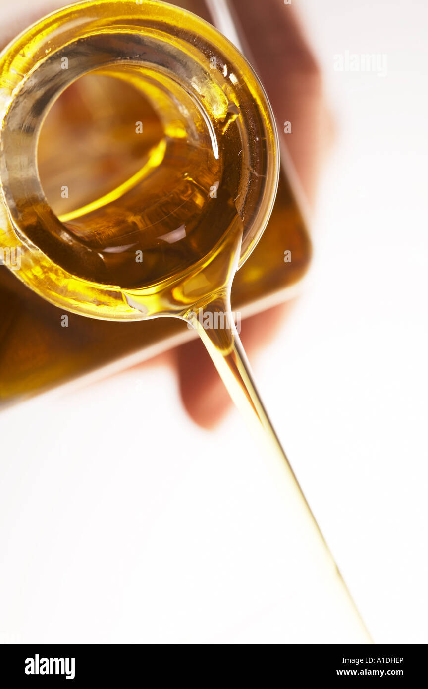 To pour out olive oil Stock Photo - Alamy