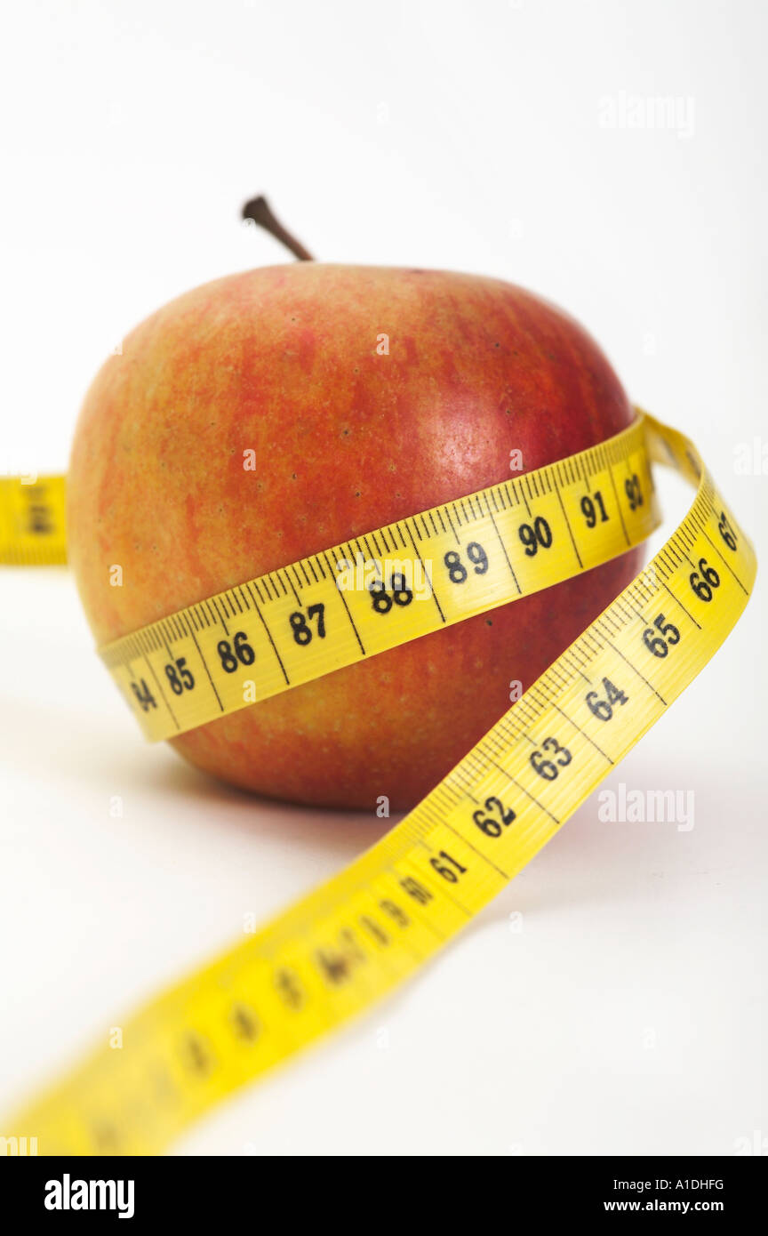 Apple with a measuring tape Stock Photo - Alamy