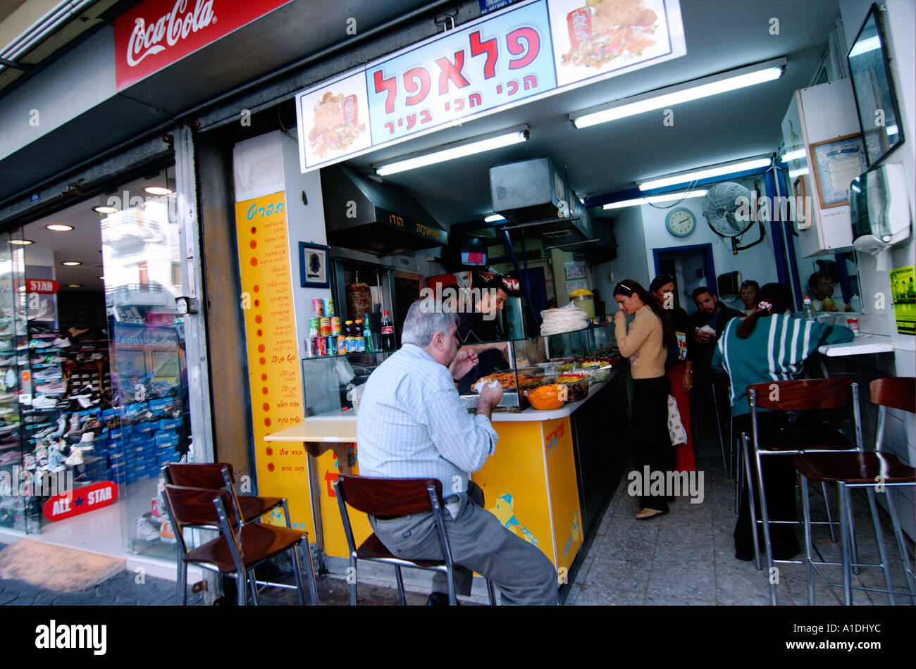 Israel Tel Aviv Local people eating at a Falafel stand in Sheinkin ...