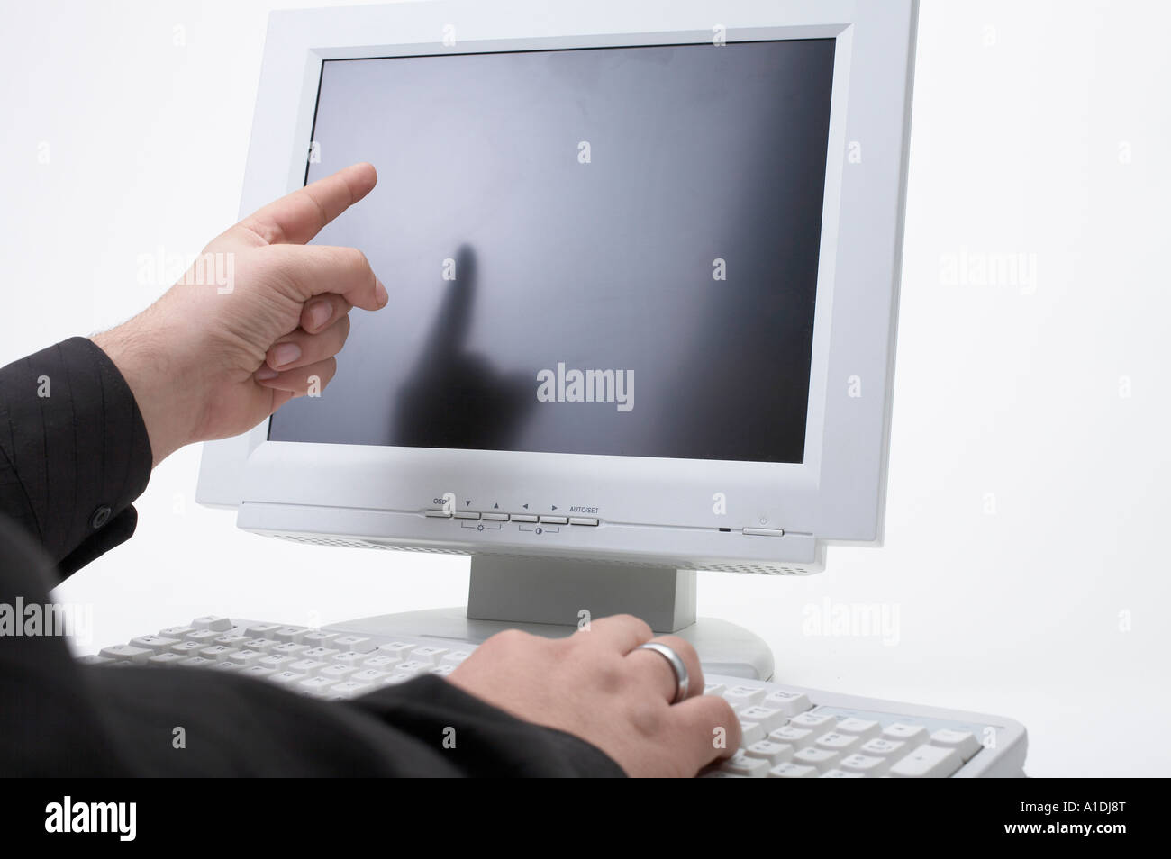 Man points to display Stock Photo - Alamy