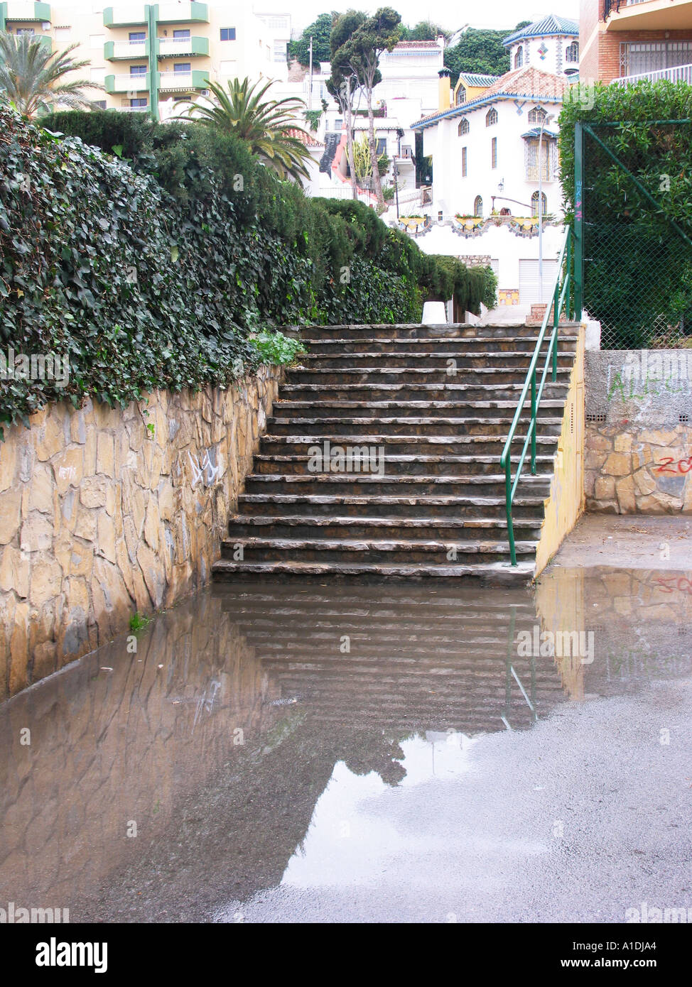 Water at bottom of steps in urban setting Stock Photo - Alamy