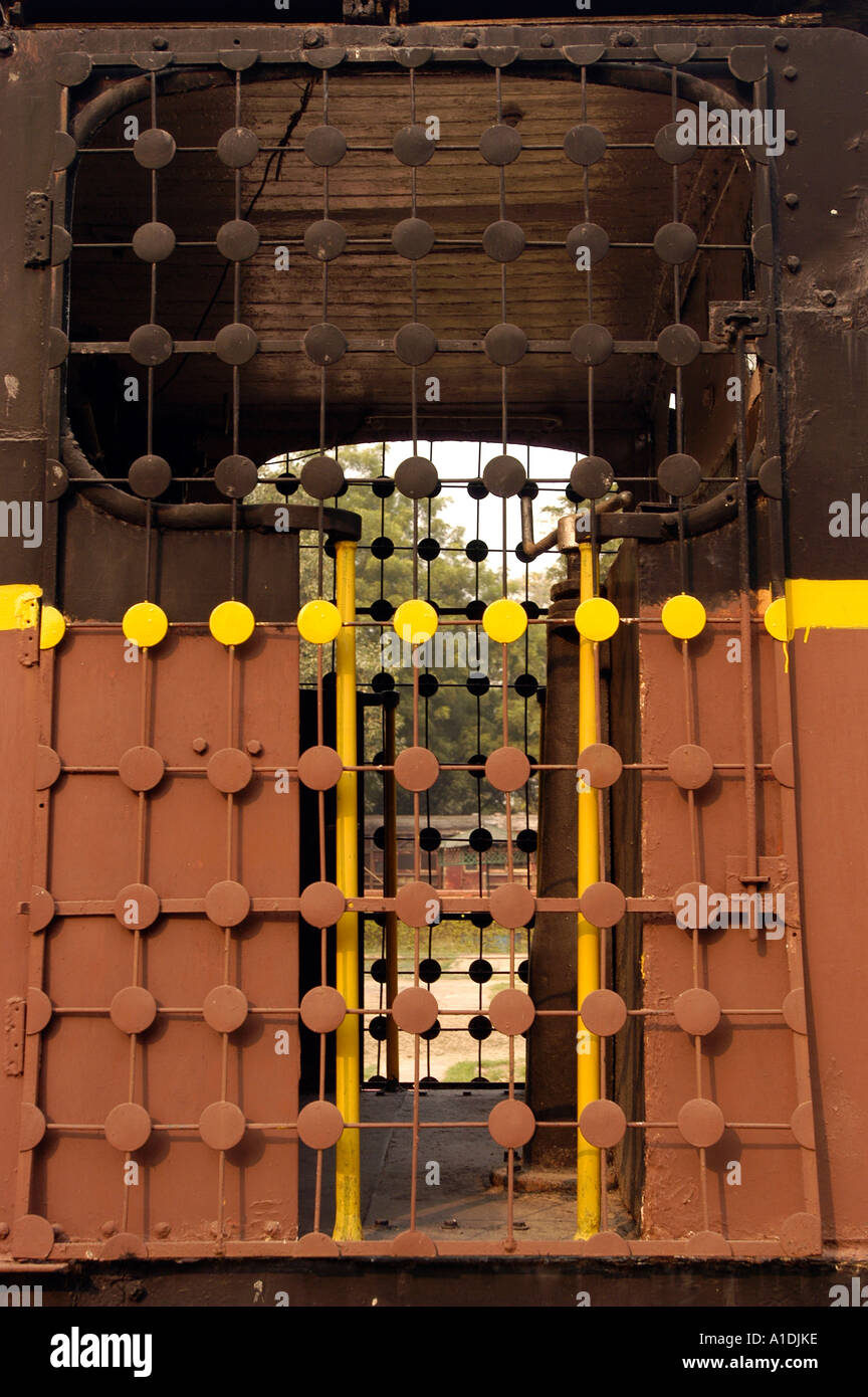 Close-up view of a metal security grate on an Indian Train door with ...