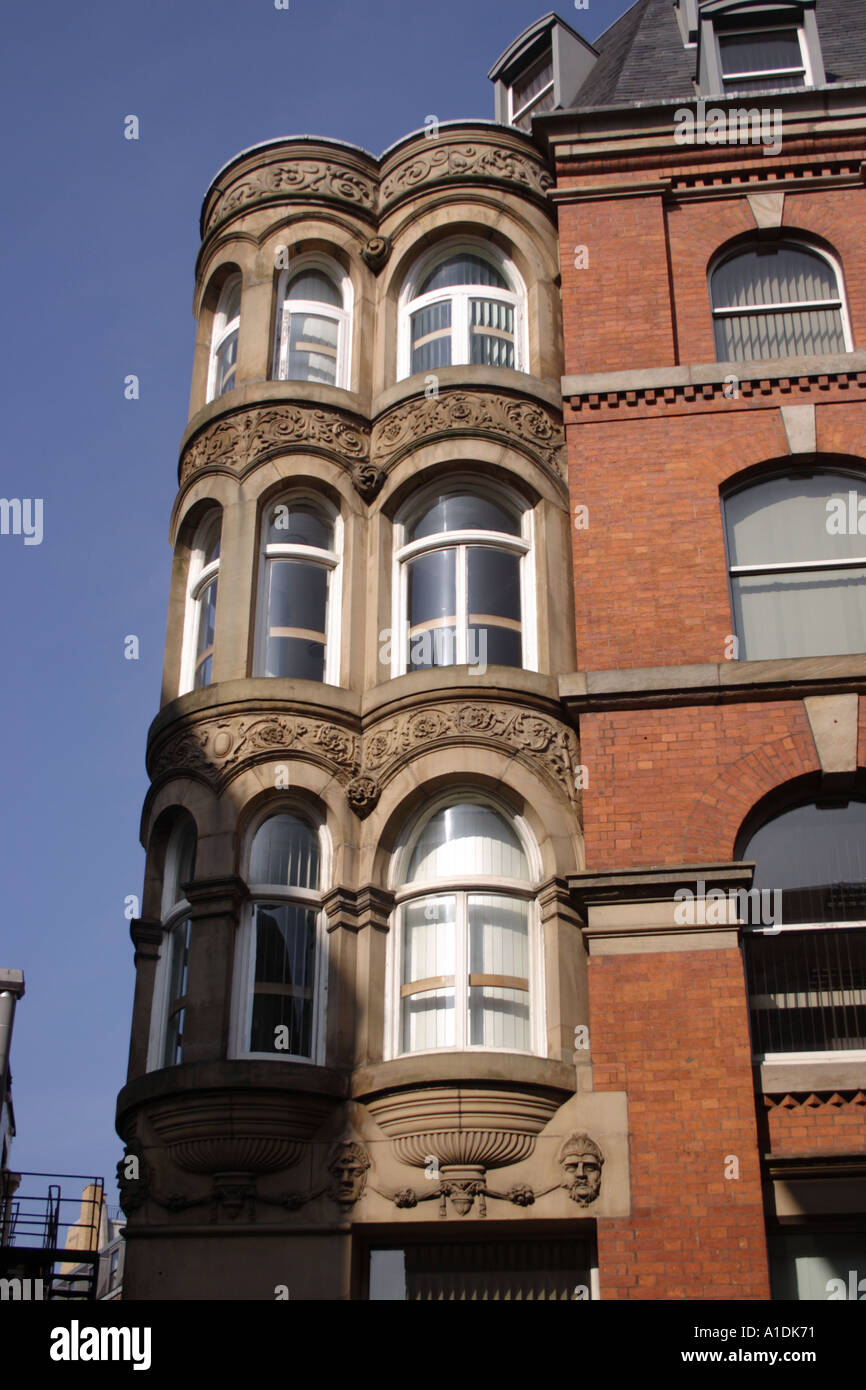 Beautiful and lively stone semi circular oriel windows on the corner of ...