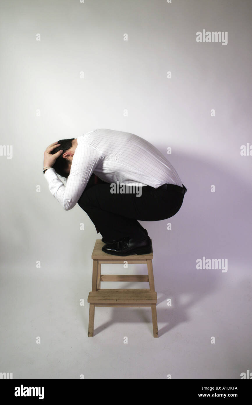 Crouched Man Stock Photos & Crouched Man Stock Images - Alamy