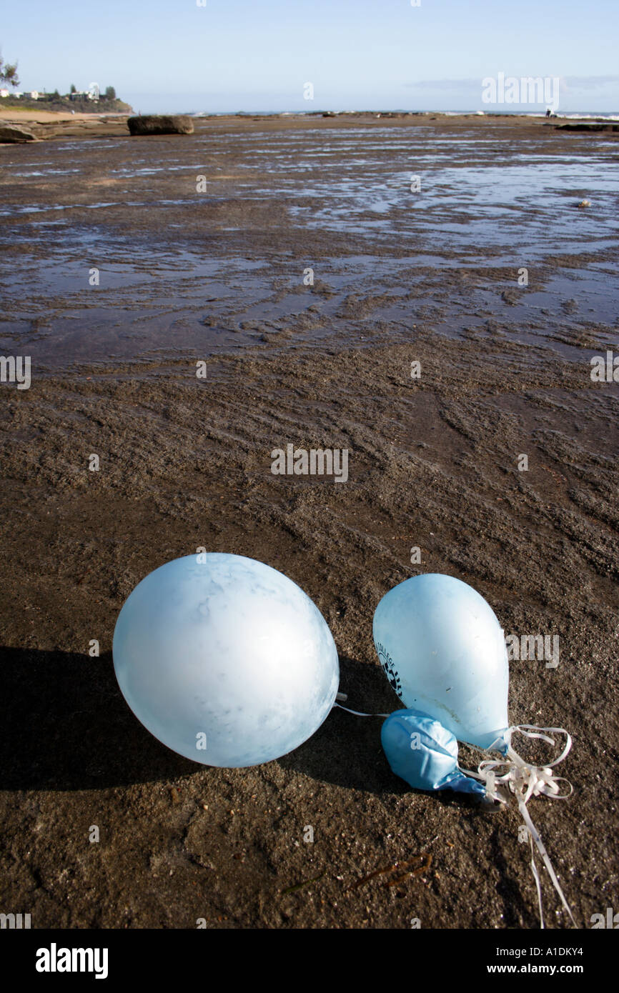 Deflated balloons at a beach hi-res stock photography and images - Alamy