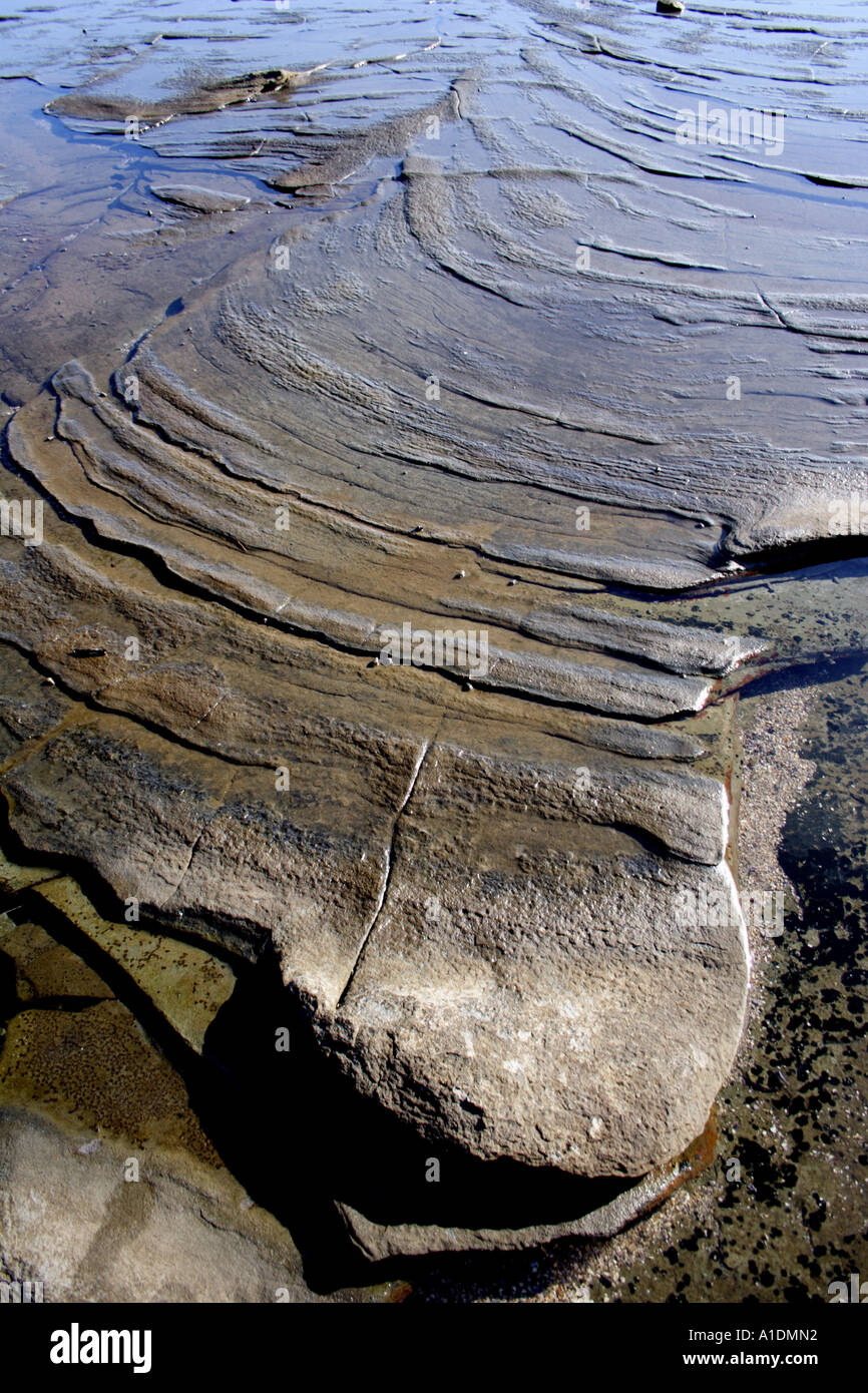 PATTERNS IN ROCK AND SAND CAUSED BY THE MOVEMENT OF THE OCEAN Stock ...