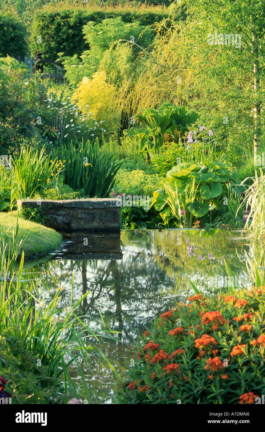 converted Mill with large garden and lake Stock Photo - Alamy