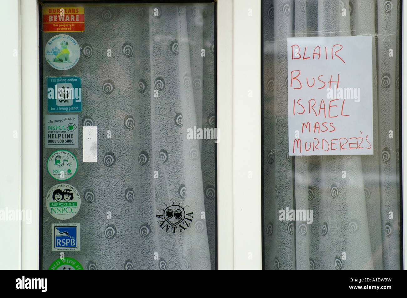 Blair Bush Israel mass murderers protest sign in window of british ...