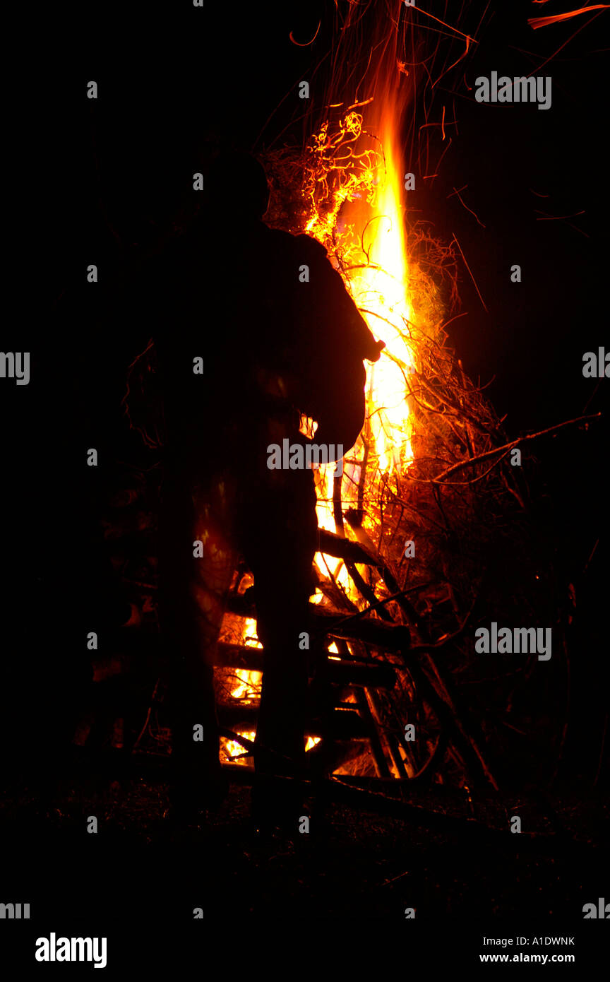 Figure body in front of huge flame fire blaze in night, Spirit of ...