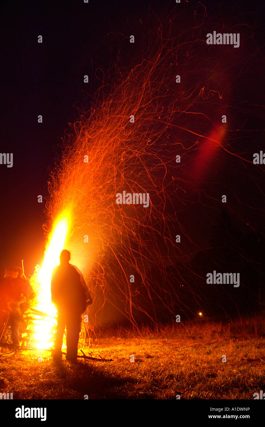 Figure body in front of huge flame fire blaze in night, Spirit of ...