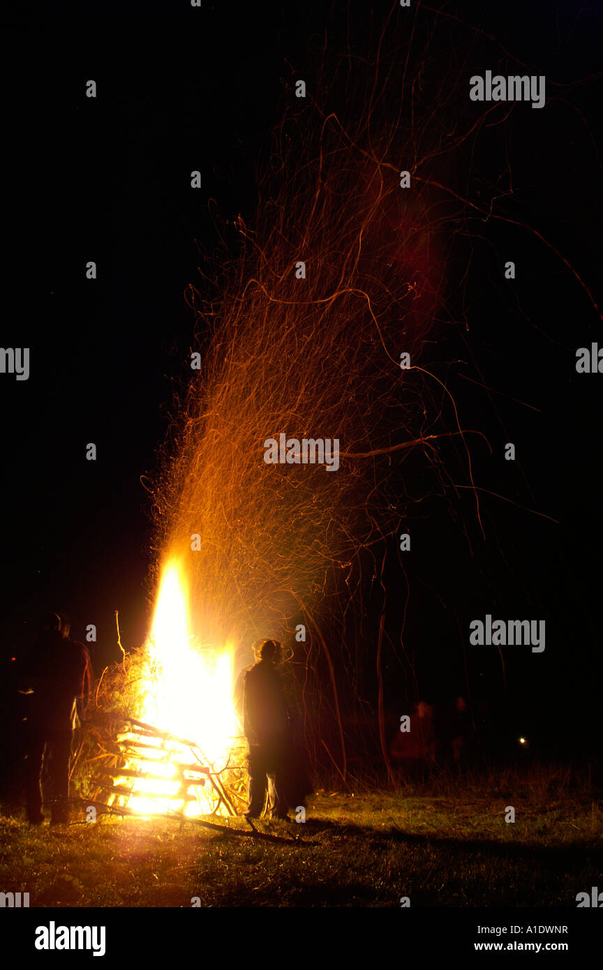 Figure body in front of huge flame fire blaze in night, Spirit of ...