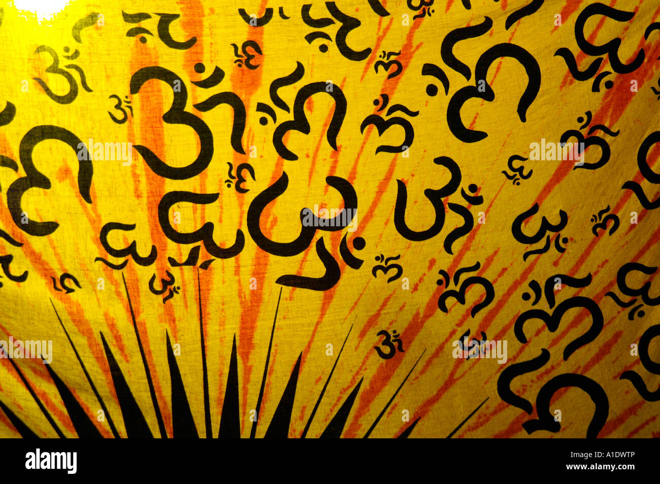 OM holy mantra sign text on yellow textile rug blanket linen Stock ...
