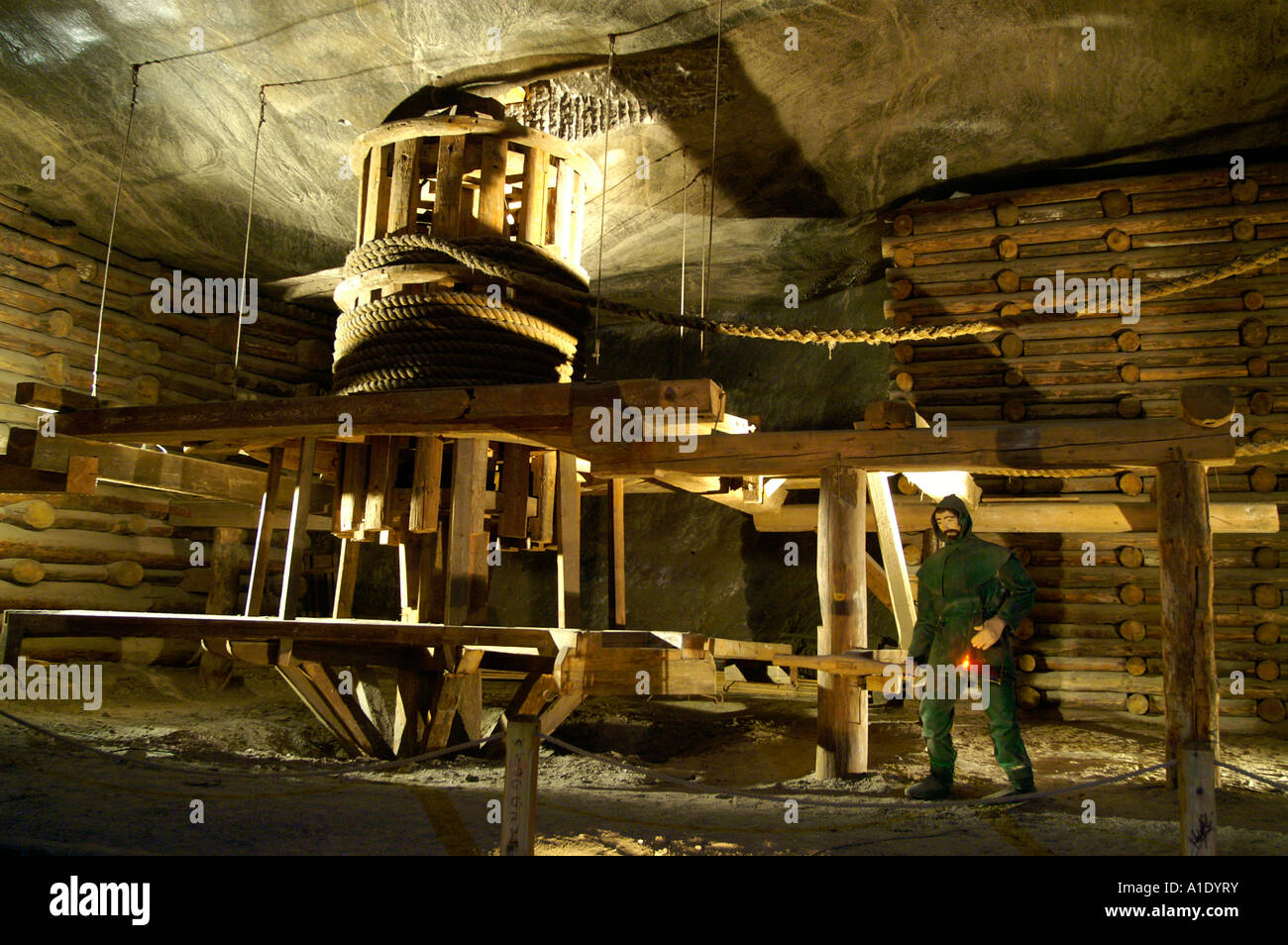 Medieval miners workers - man and wooden lift machine in Kopalnia solna ...