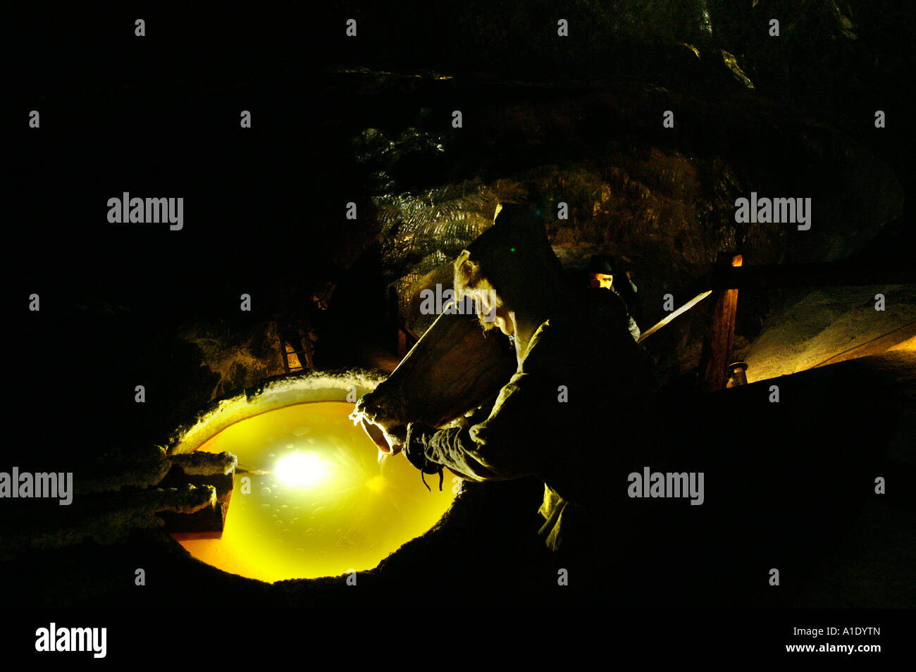 Medieval miners workers - man with salt water solution pool in Kopalnia ...