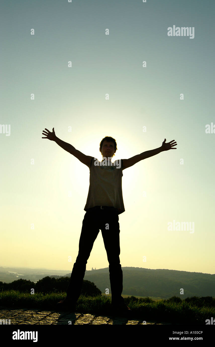 Man boy human silhouette worshipping greeting sun bright sky and ...