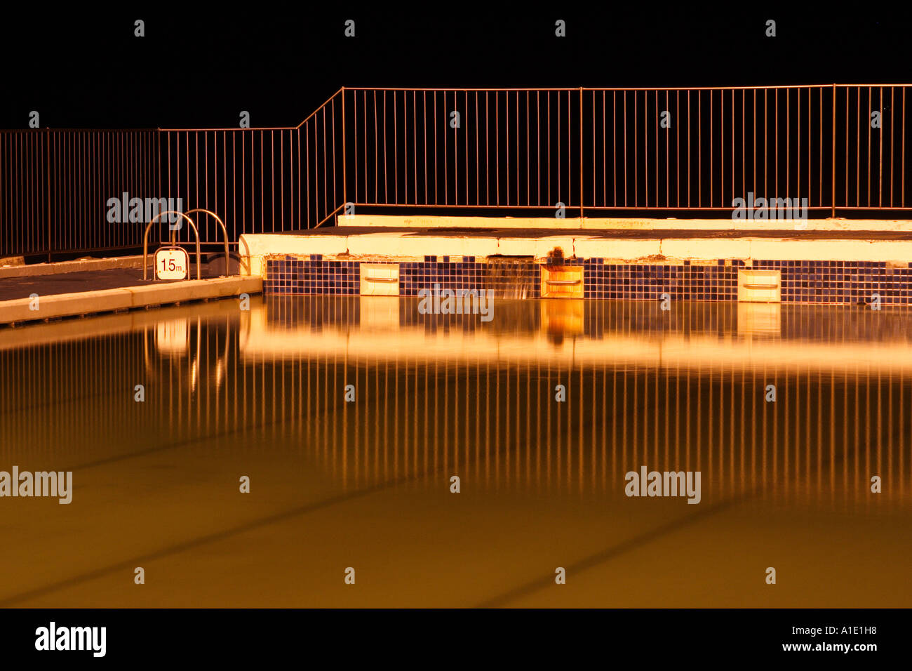 NIGHT VIEW OF AN OCEAN FED SWIMMING POOL Stock Photo - Alamy