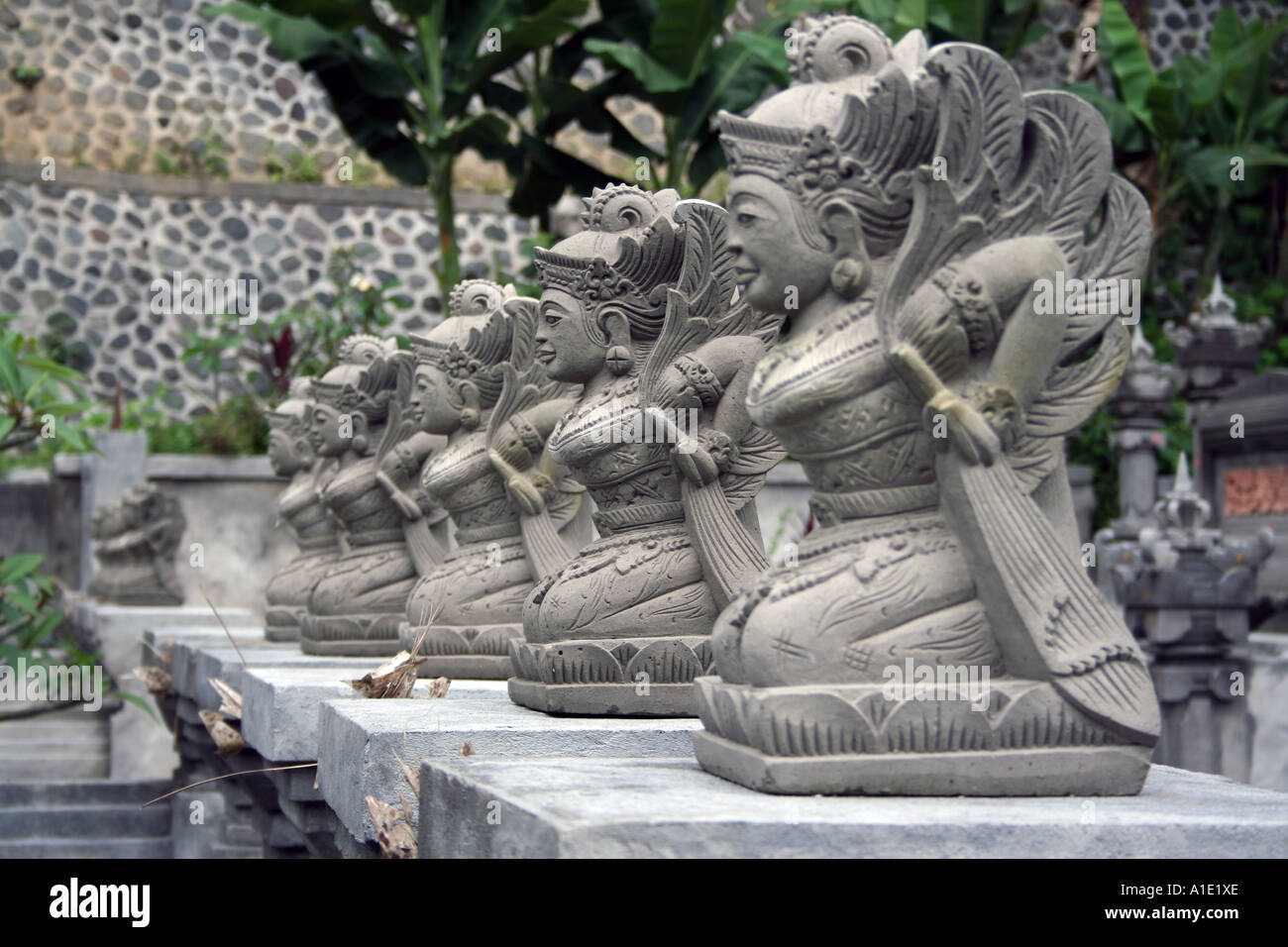 Line of Bali stone carvings Stock Photo - Alamy