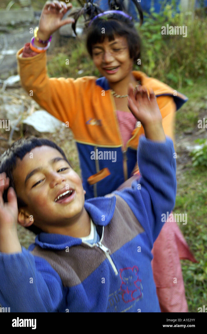 Two young native indian children boy and girl dancing outdoors, Kalga ...