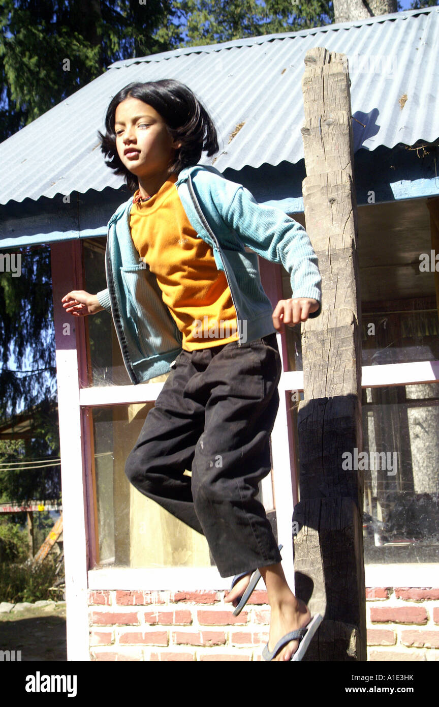 Young native indian children jumping from wooden log outdoors, Kalga ...