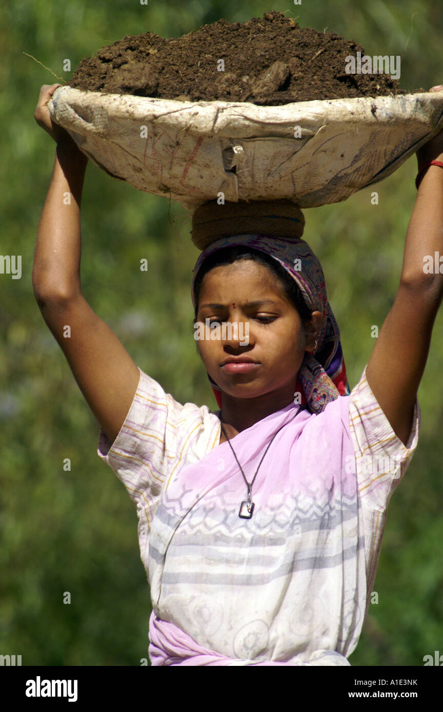 Indian Teenage Woman In Sari Working As Construction Site Worker